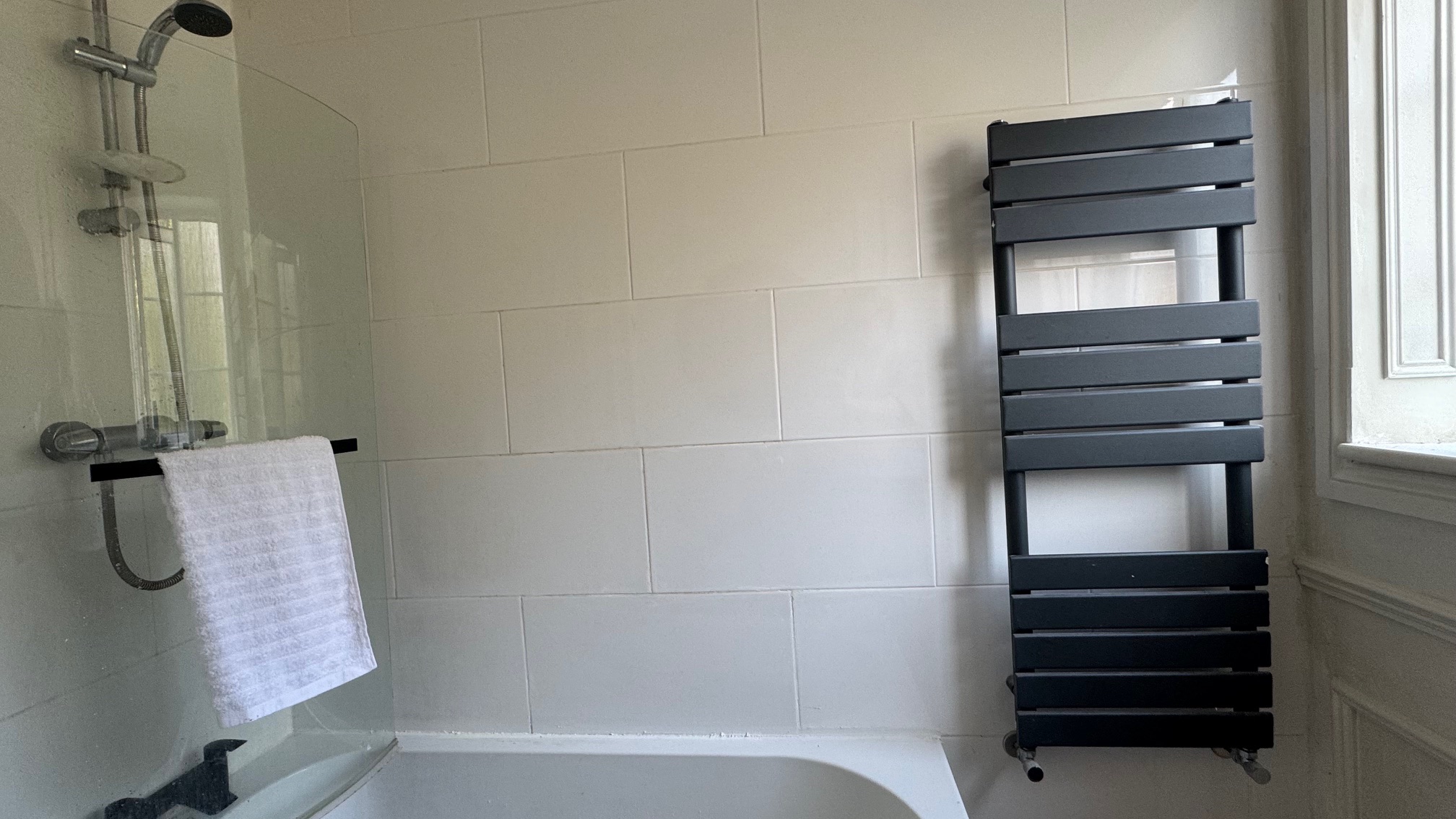 How to microcement over tiles & transform a tired bathroom - Claire ...