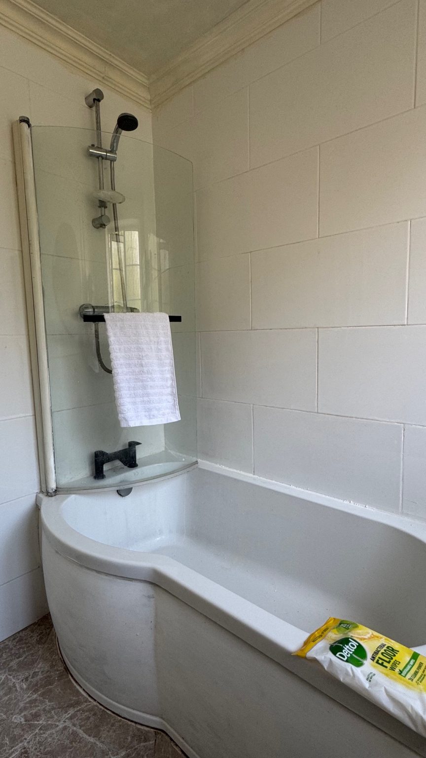 How to microcement over tiles & transform a tired bathroom - Claire ...