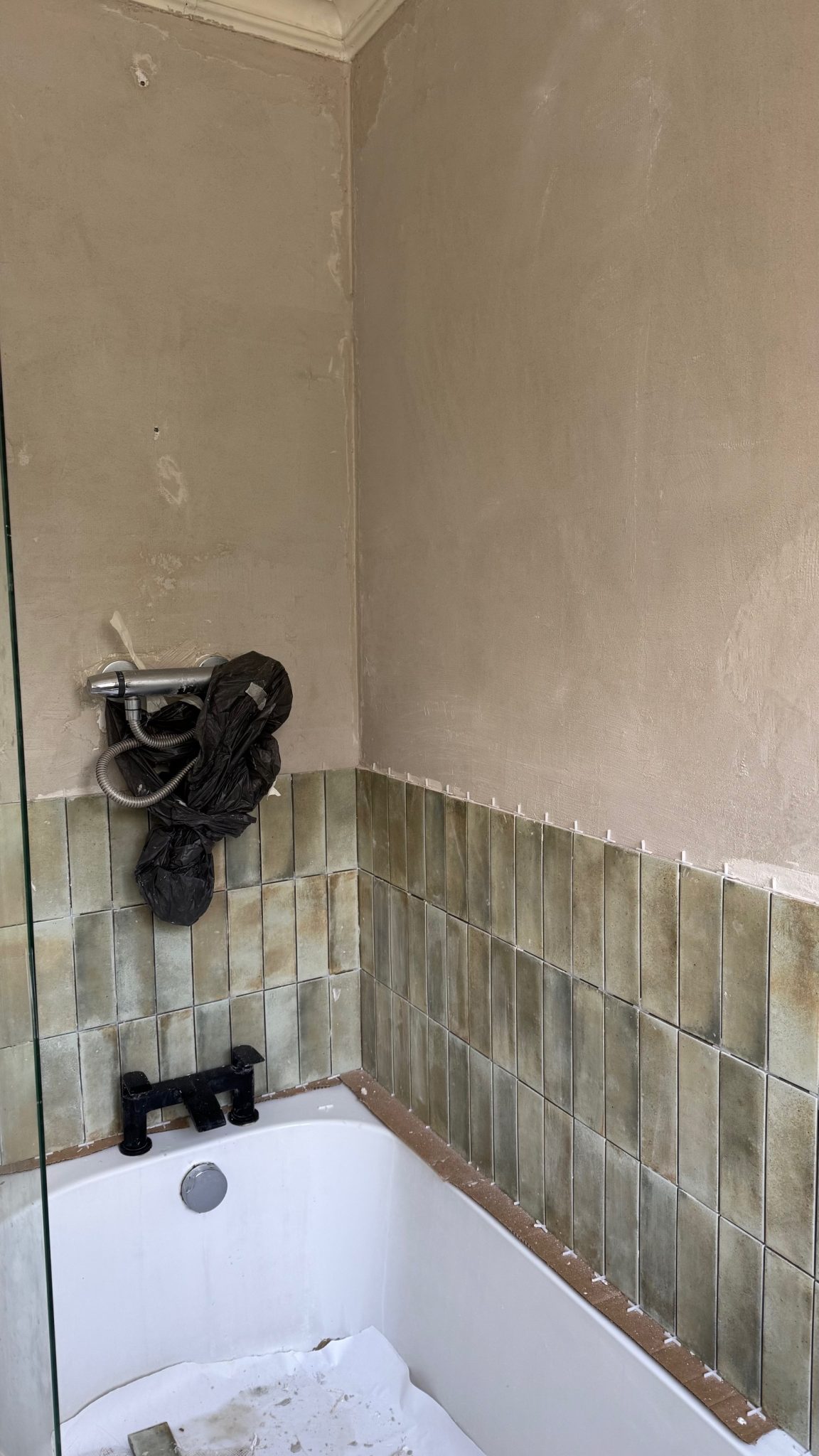 How to microcement over tiles & transform a tired bathroom - Claire ...